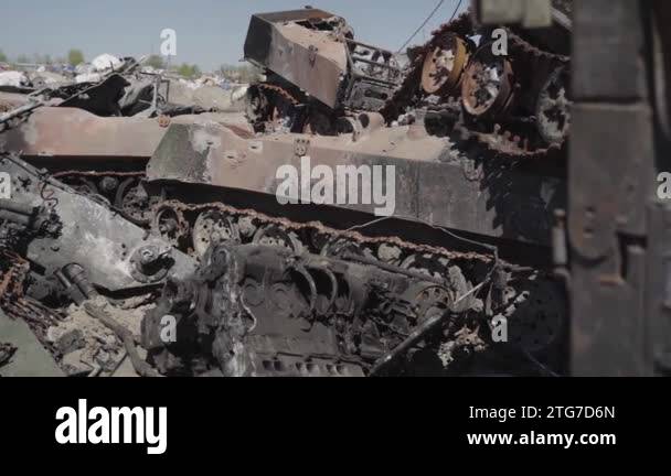 Burnt military equipment after a missile attack. Abandoned rusty military equipment. City of ...