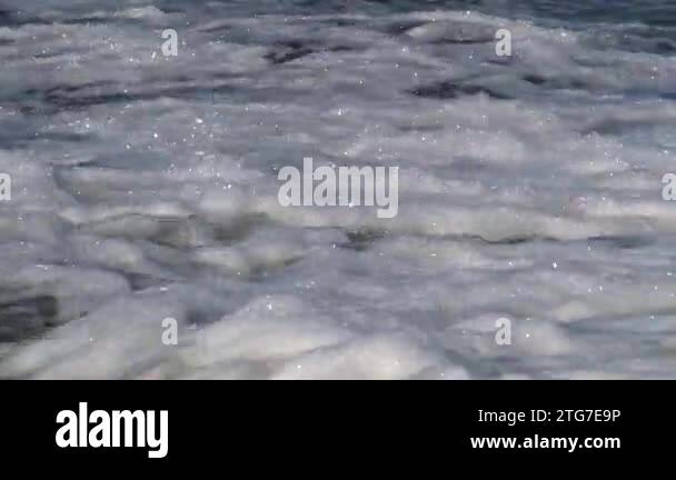 Water pollution. Dirty water from treatment plants flows through a pipe ...