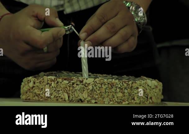 A Prison Officer Lighting Candle on a Birthday Cake for an Inmate ...