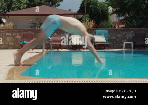 Man diving into pool Stock Videos & Footage - HD and 4K Video Clips - Alamy