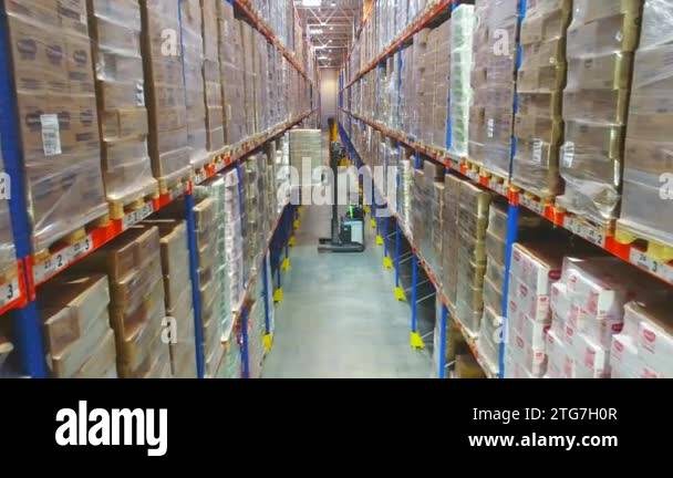 Modern forklift in a warehouse. Workflow in a modern warehouse. Large ...