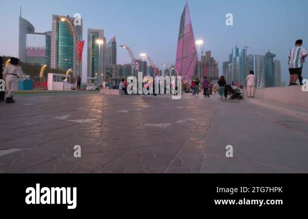 Doha corniche in Doha Qatar zooming in sunset shot showing Qatar ...