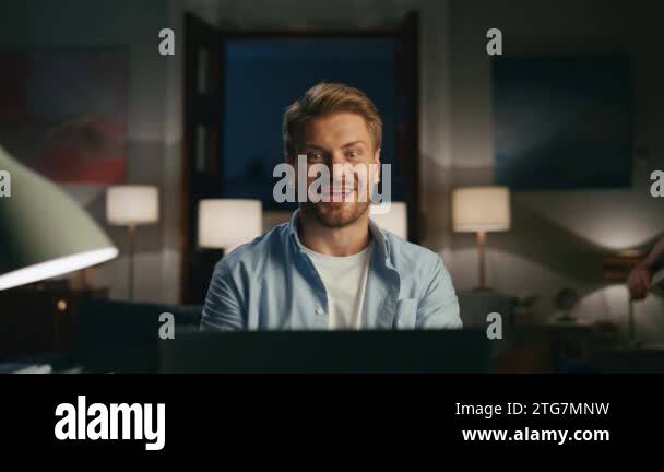 Bearded man talking laptop at night closeup. Confused guy feeling ...