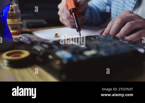 Man Unsolders Transistors, Radio Parts on Electronic Board with ...