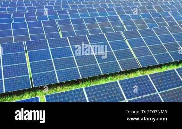 Long rows of sun panels built on grass field at electrical station in ...