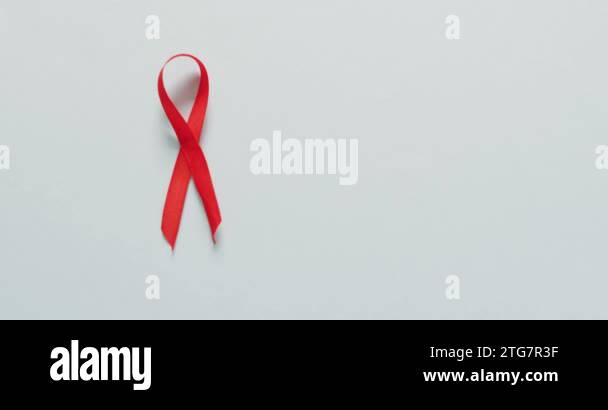 Video of red blood cancer ribbon on pale blue background. medical and ...