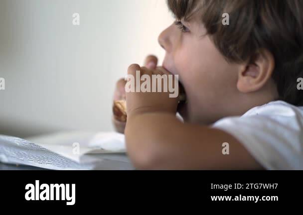 Little boy taking a big bite of bread. Child wide open mouth eating ...