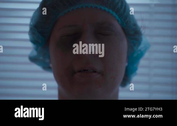 Victim of domestic violence with bruised face and broken teeth and ...