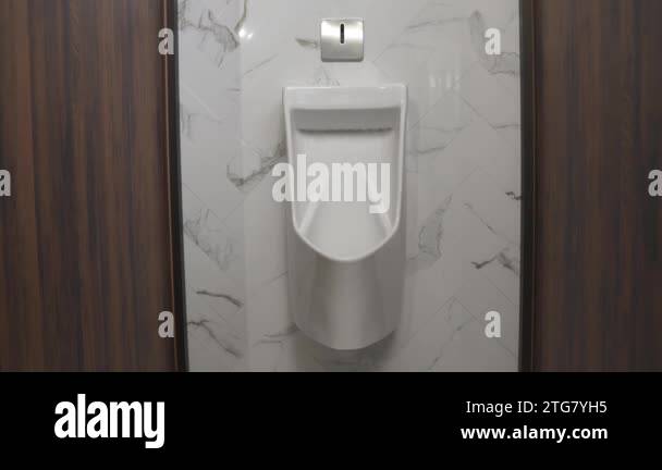 Men's restroom footage. The process of releasing clean water to remove ...