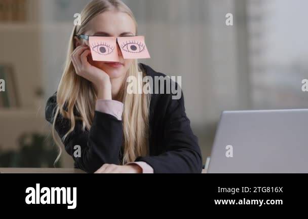 Tired sleepy caucasian woman with adhesive notes on eyes sticky notes ...
