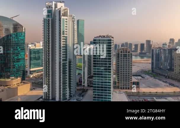Business Bay Dubai office skyscrapers with water canal aerial timelapse ...