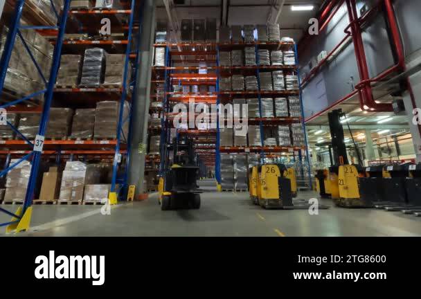 Active work in the warehouse. Modern forklift works in a warehouse ...