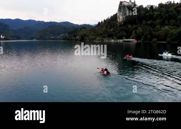 A shot from a drone of a rowing competition. Bled Castle. Drone view of ...