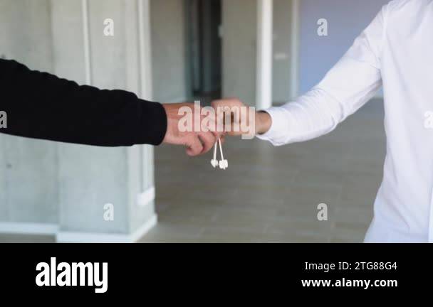 Agent and client shaking hands after signed document and done business ...