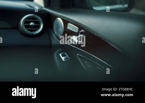 lowering the window in a luxury car with a button Stock Video Footage ...