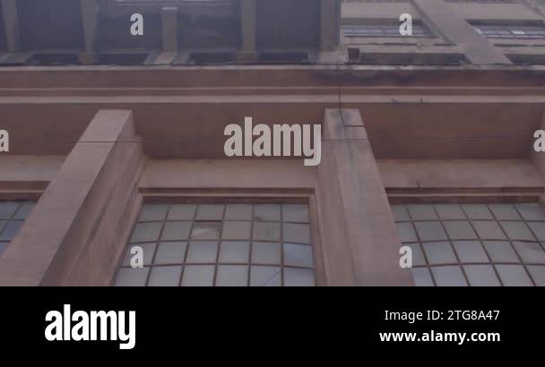 Facade of an industrial building with windows, rectangles and glass ...