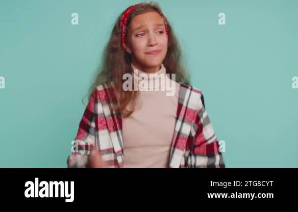 Young teenager child girl kid shakes finger and saying No, be careful ...