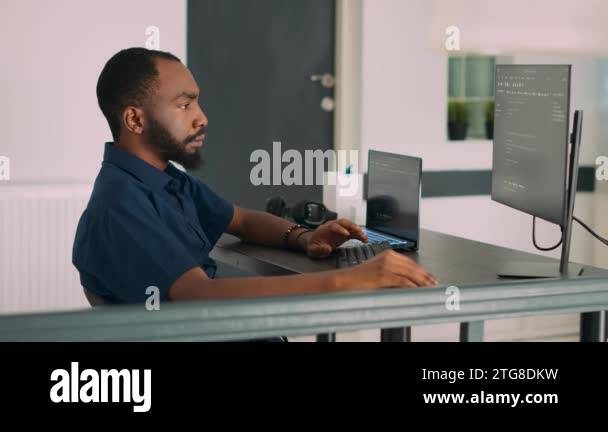 Software Programer Writing Program Code To Develop Database System In Front Of Computer