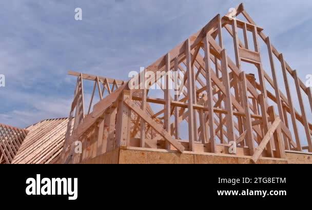 Roofing construction in wooden roof frame installation the truss beams ...