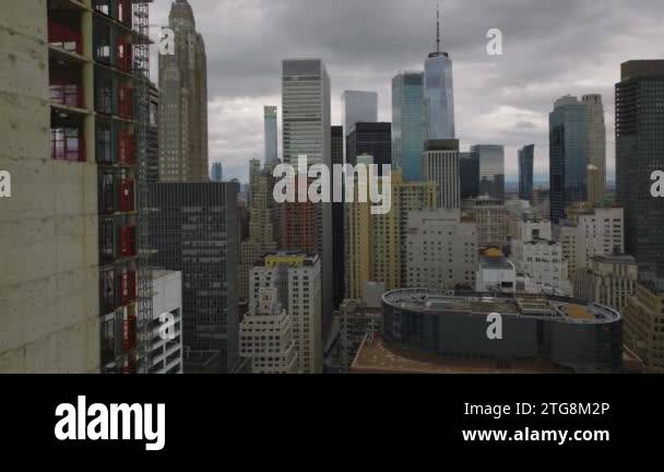 Sliding reveal of construction site of new modern high rise building ...