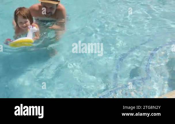 Kid father pool child swimming pool happy dad and daughter playing ...