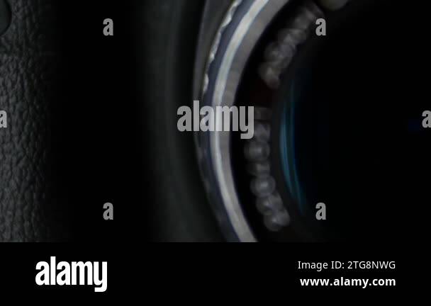 Diaphragm of camera lens aperture, cam moves to the left, close up ...