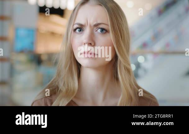 Caucasian girl woman serious listening answer no wave head negative ...