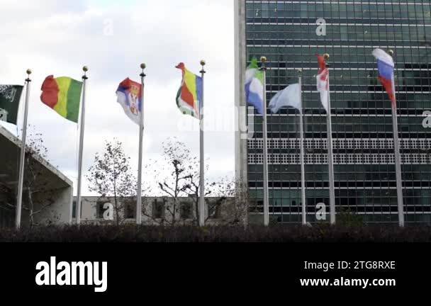 Flags in front of United Nations in New York City. Slow motion flags ...