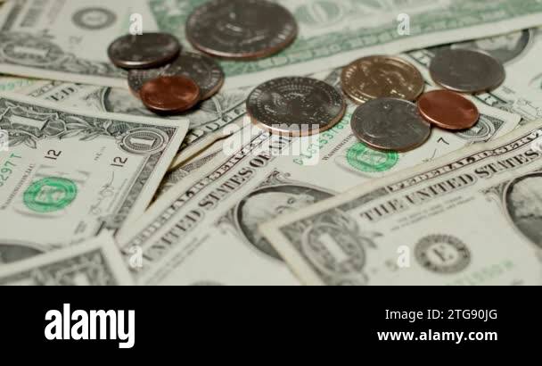 US Dollar banknotes and coins. US Currency and cash. Coins and ...