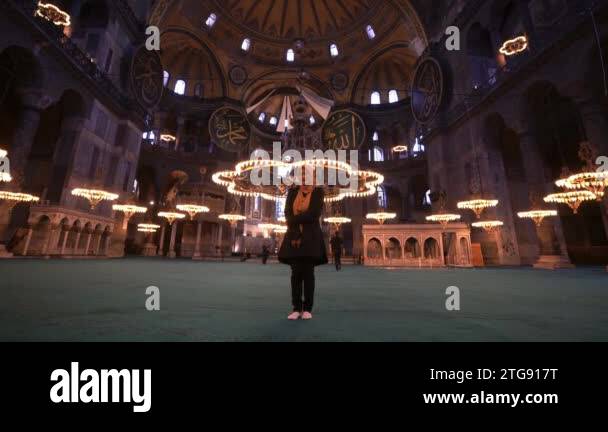 beautiful Asian woman with a head scarf standing inside Hagia Sophia ...
