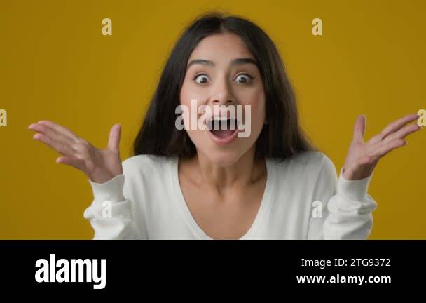 Close up portrait in studio yellow background Indian ethnic woman girl ...