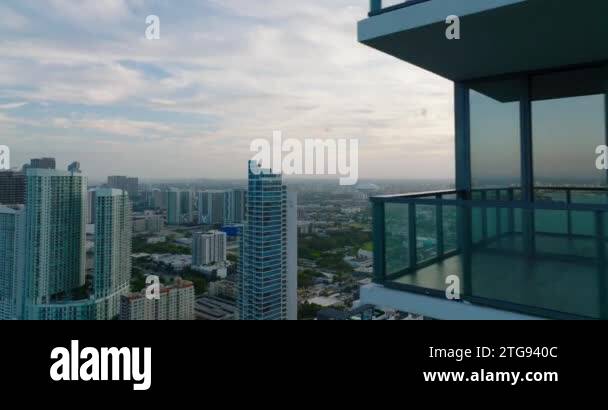 Fly around modern high rise apartment building with balconies. Aerial ...