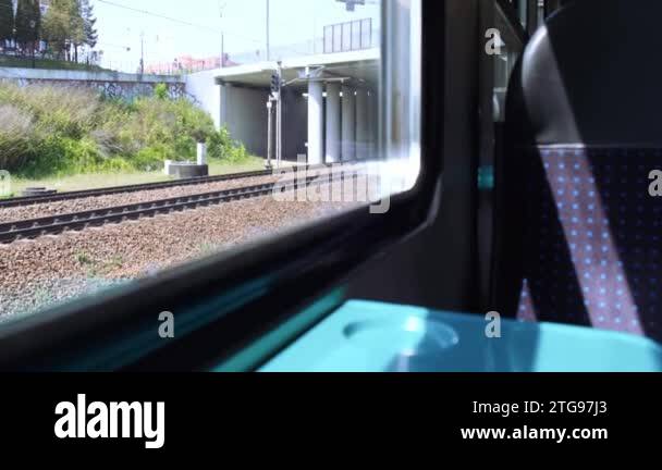 View on railroad track from the window of fast train. 4K Interior view ...