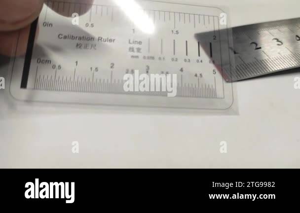 Calibration ruler. The accuracy of the metal ruler is checked with a ...