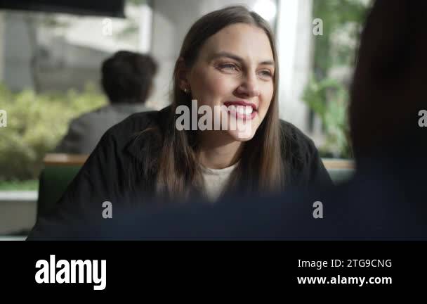 Woman speaking with friend at coffee shop. Closeup girl face in ...