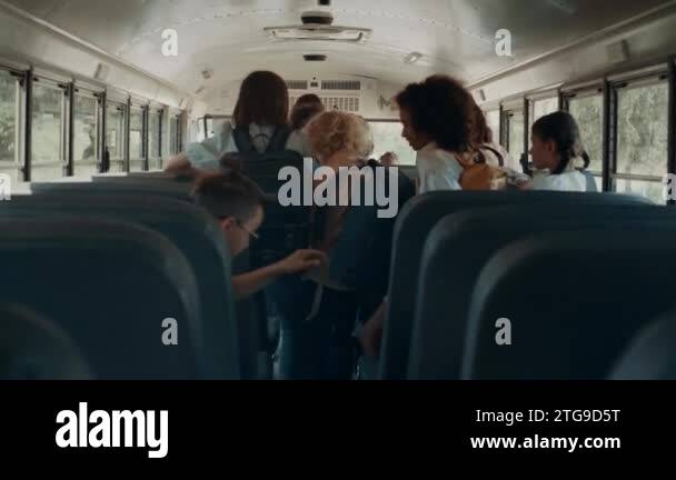 Energetic pupils leave academic shuttle. Friendly crowd go out school ...