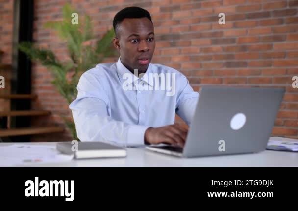 Upset frustrated african american man, office worker, top manager, uses ...