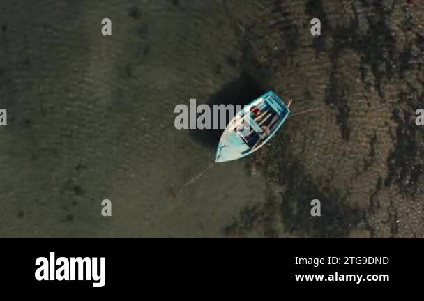 Beautiful drone flight over boats that are parked near the shore where ...