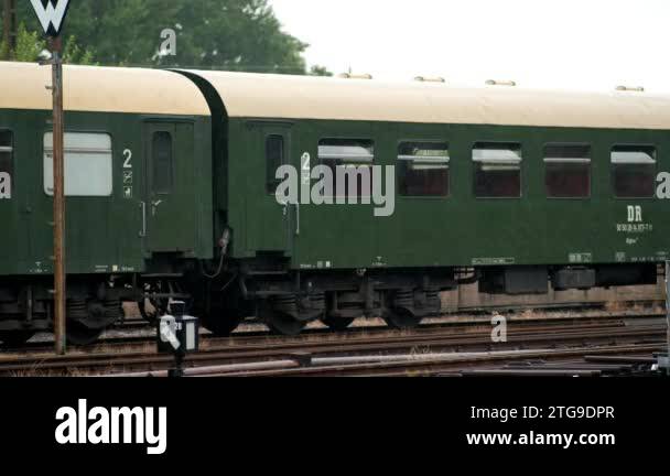The old abandoned passenger cars of a German train in the rain Stock ...