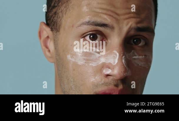 Beauty man face. Closeup of beautiful young male model with fresh skin ...