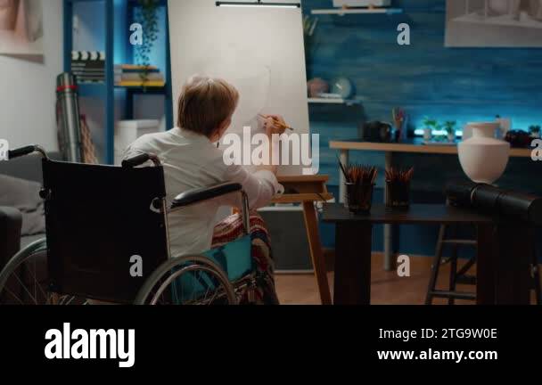 Female wheelchair user creating vase model masterpiece with artistic ...