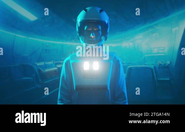 A woman astronaut in a space suit aboard the orbital station. A young ...