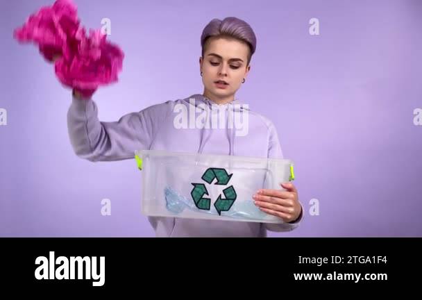Confident ecofriendly person gen Z with short hair holding container ...