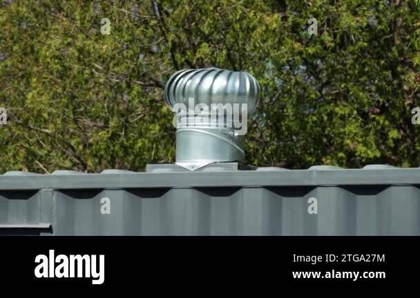 Roof made of cargo container with metal chimney rotating. Chimney ...