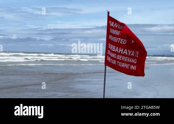 Danger. Red flag warning of the dangers of swimming in the Indian Ocean ...