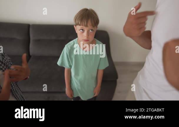 Kid son feels upset while parents fighting at background, sad little ...