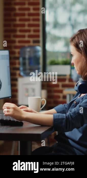 Vertical video: Female engineer working on turbine component ...