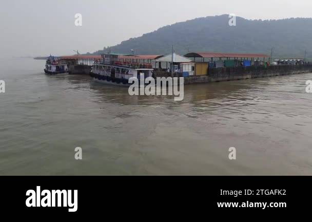 A Reaching the Elephanta Caves passenger boat station by Nautical Vessel ferry boat, Mumbai ...