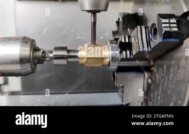 Process of vertical drilling in modern 4-axis CNC milling machine Stock ...
