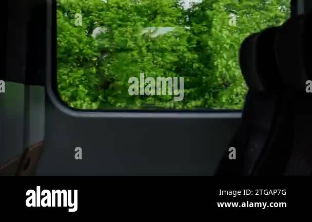 View on railroad track from the window of fast train. 4K Interior view ...